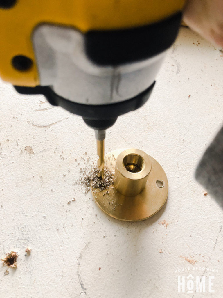 Make Holes in the Brass Flange to attach toilet paper holder to cabinet ...