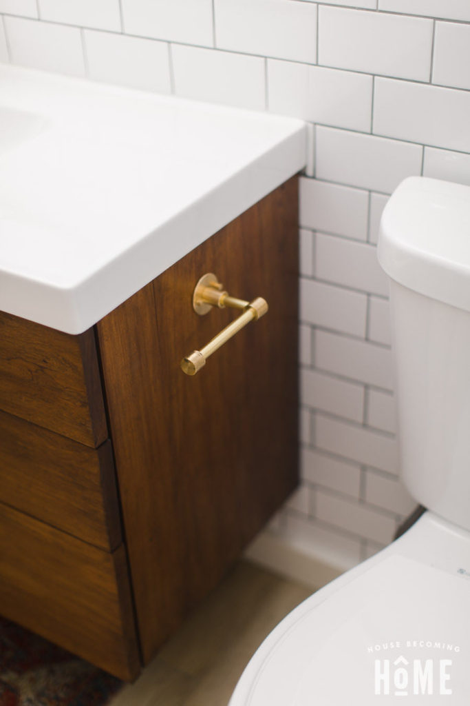 Finished Brass Toilet Paper Holder Mounted To Vanity House Becoming Home finished-brass-toilet-paper-holder-mounted-to-vanity-house-becoming-home